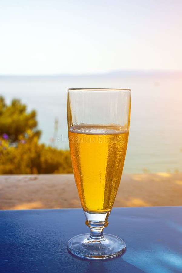 Glass of Cold Beer on a Table Stock Photo - Image of table, horizon ...