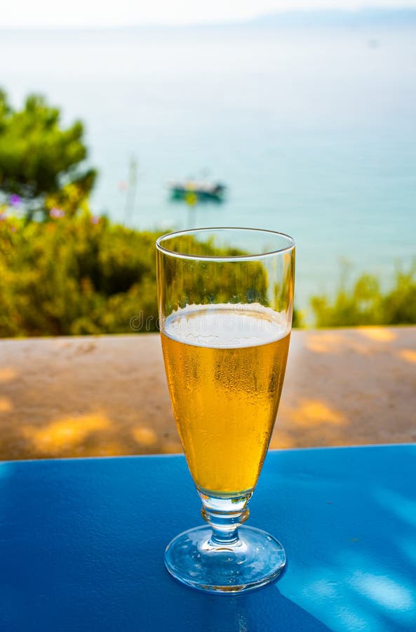 Glass of Cold Beer on a Table Stock Photo - Image of table, thirsty ...