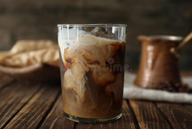 Glass of Cold Coffee with Milk on Wooden Table Stock Photo - Image of ...