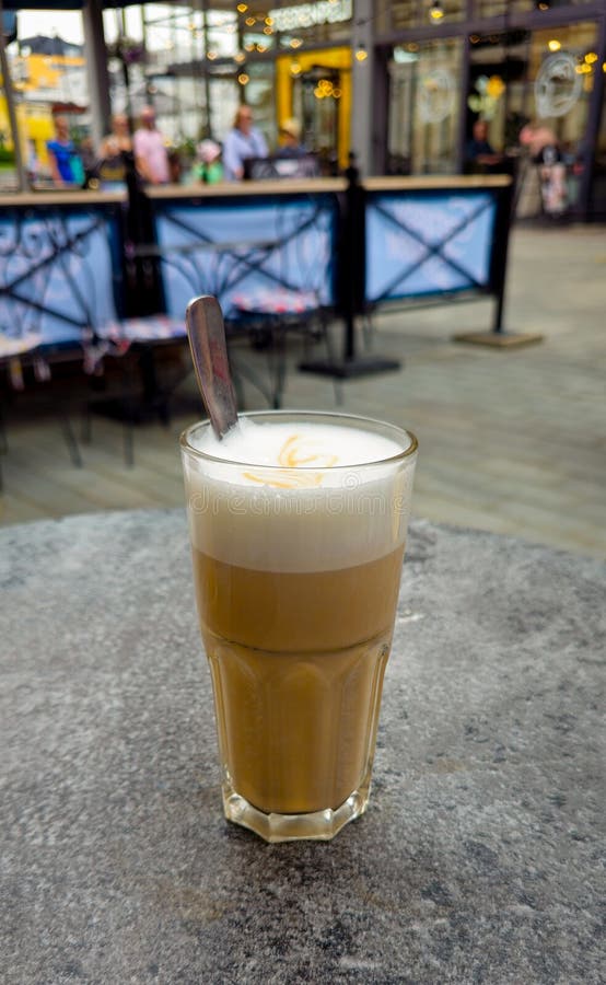 Glass of Cold Ice Coffee Latte Refreshment on a Table in a Restaurant ...
