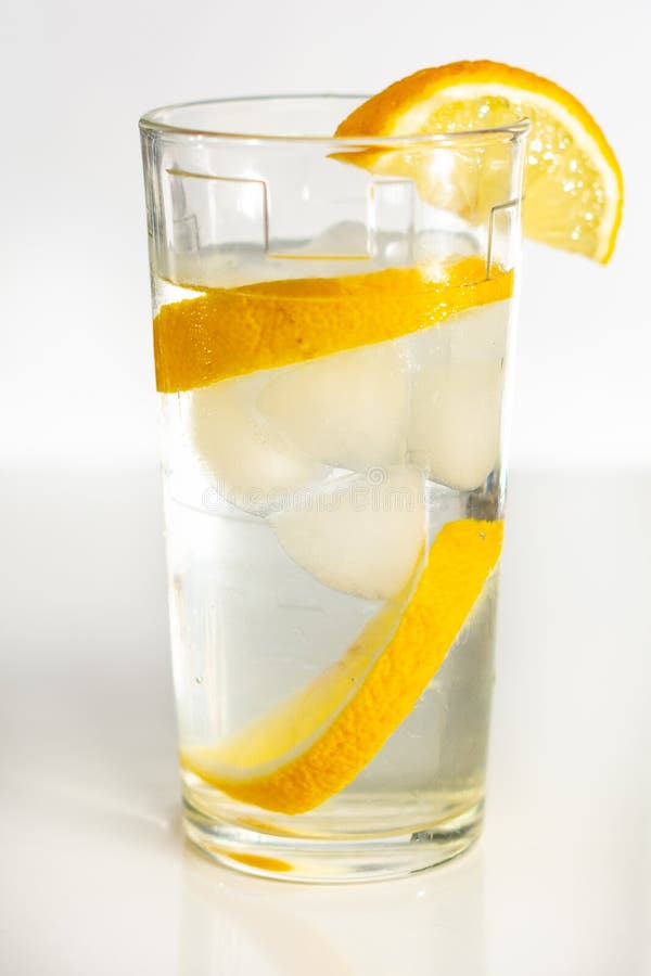 Glass of Cold Water with Slices of Ice and Lemon Stock Image - Image of ...