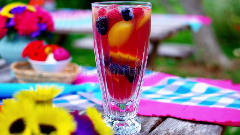 Refreshing Fruit Punch Beverage on a Decorated Picnic Table Stock Video ...