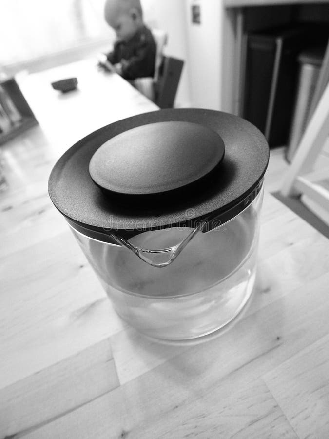 Glass Container with Water Inside Having a Black Cap on Stock Photo ...