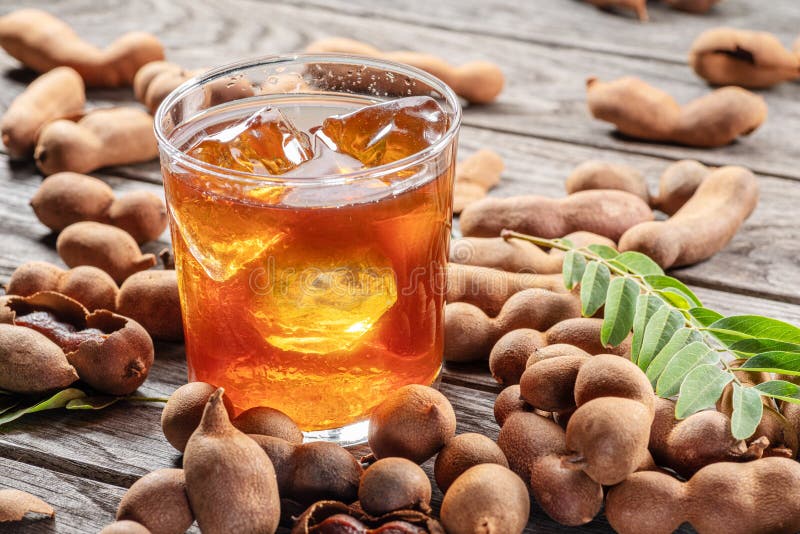 Glass of Cool Refreshing Tamarind Drink and Some Tamarind Fruit on ...