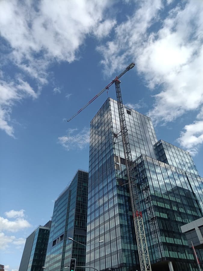 Glass-covered Skyscrapers Rise into the Blue Sky Stock Photo - Image of ...