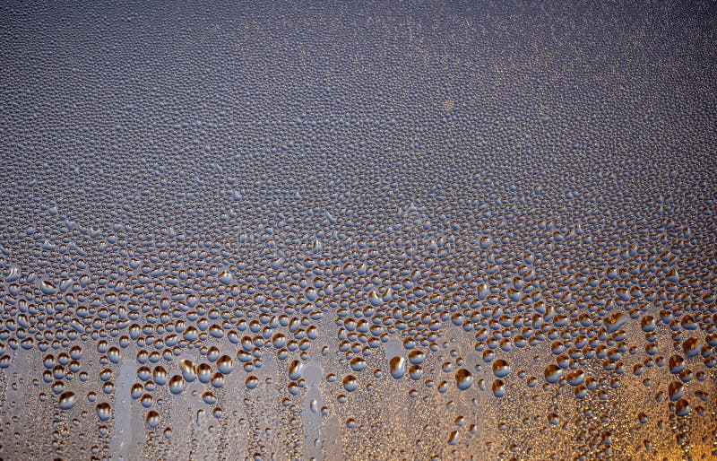 Glass Covered with Water Drops of a Golden Hue Stock Image - Image of ...