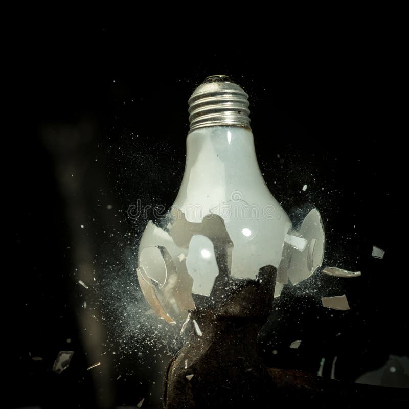 Frosted Glass Light Bulb Smashes on the End of a Hammer Stock Image ...