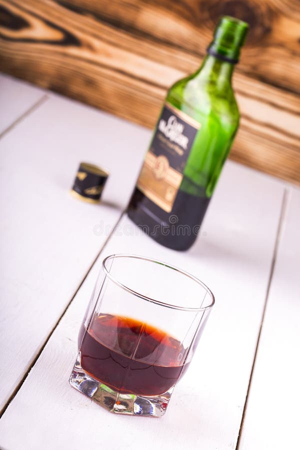 Glass Cup with Alcohol and Open a Bottle of Whiskey Stock Photo - Image ...