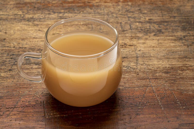 Glass Cup of Beef Bone Broth on a Wooden Table Stock Photo - Image of ...
