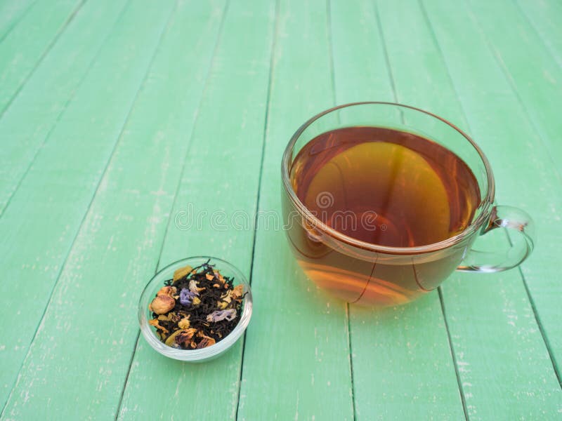 A Glass Cup of Black Tea on a Mint-colored Wooden Table Stock Photo ...