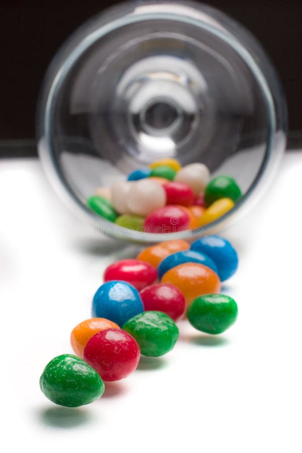 Glass Cup with Candies Spilled Out Stock Photo - Image of sparse ...
