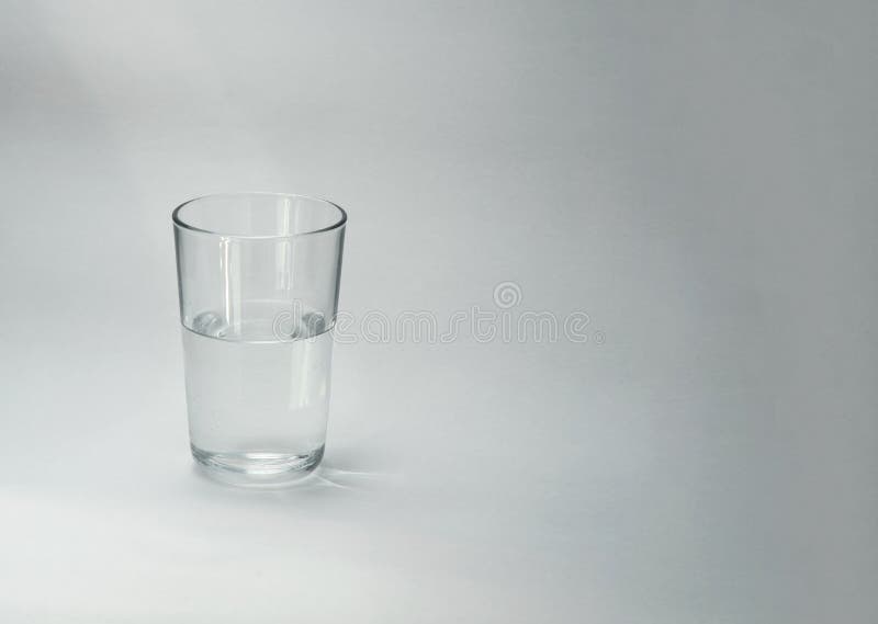Composition Glass Cup Half Filled With Water On A Cloth Background ...