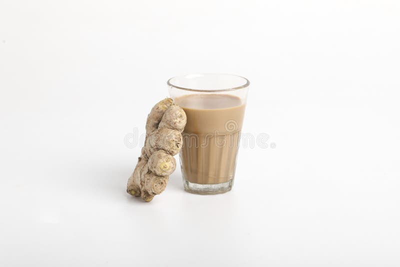 Glass Cup of Hot Ginger Tea with Ginger Rhizome Root Sliced Isolated on ...