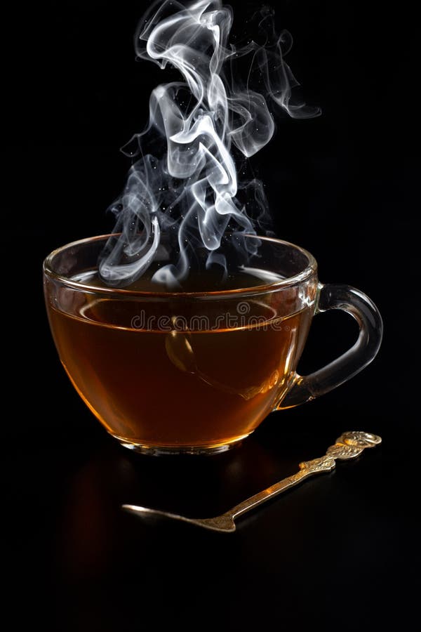 Glass Cup of Hot Tea with Spoon on the Black Background Stock Image ...