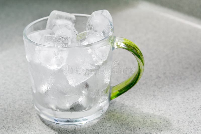 Glass cup with ice cubes stock photo. Image of transparent - 32169698