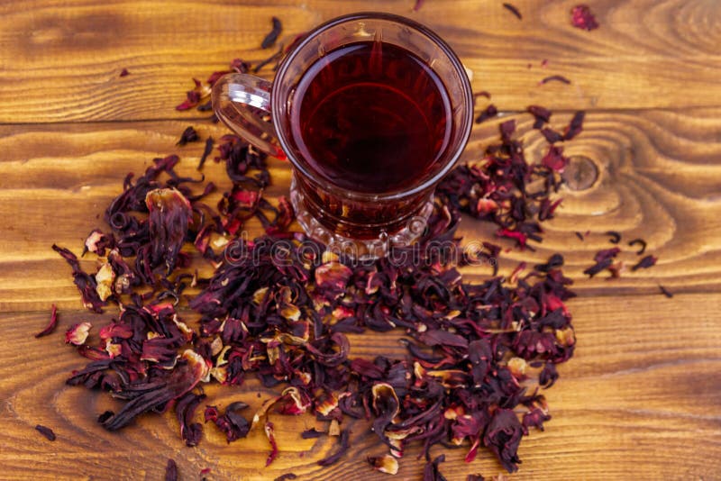 Glass Cup of Red Hibiscus Tea Carcade, Roselle on Wooden Table Stock ...
