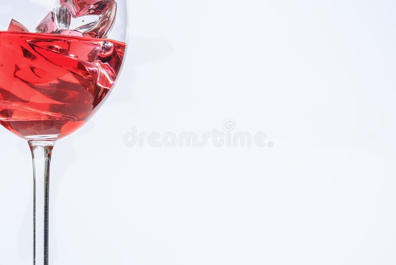 Glass Cup with Red Liquid and Ice Stock Photo - Image of isolated, fall ...