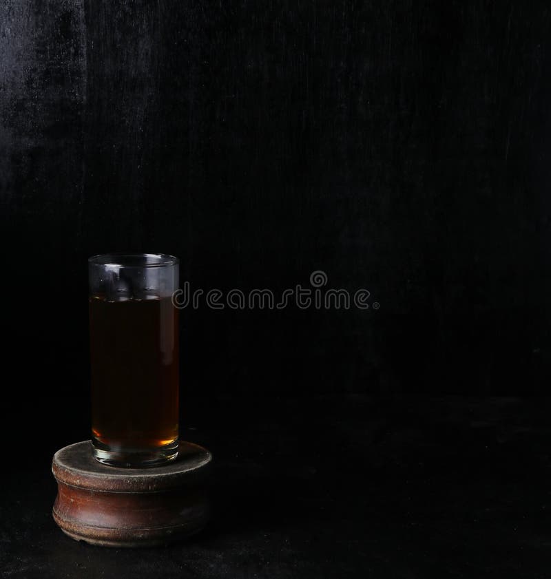 Glass Cup of Tea on Black Background Stock Photo - Image of gold, drink ...