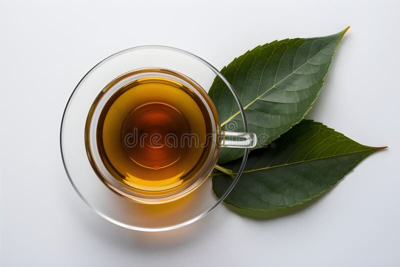 Glass Cup with Yellow Tea and Green Leaves, Plain White Background ...