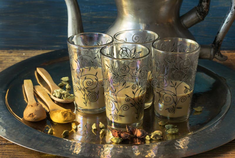 Glass Cups of Pakistani Tea with Spices in a Tray and Teapot Stock ...