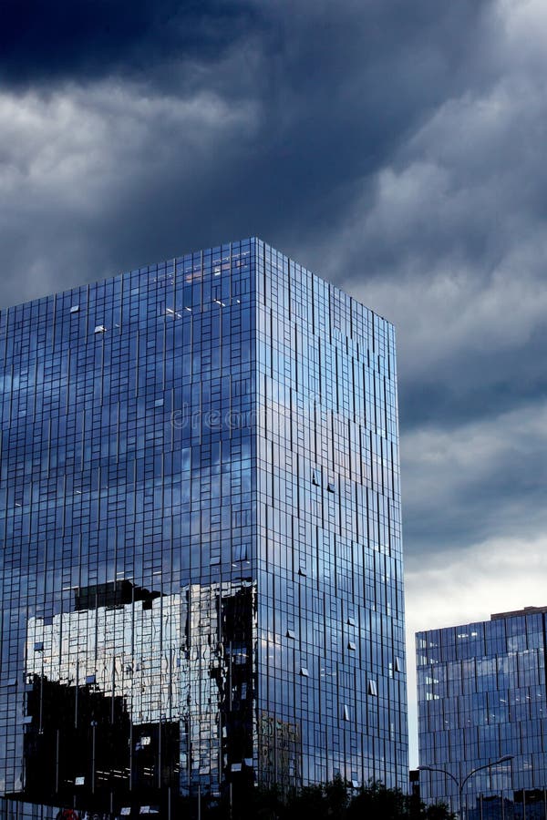The Glass Curtain Wall of a Modern Building Under the Sunset at Dusk ...