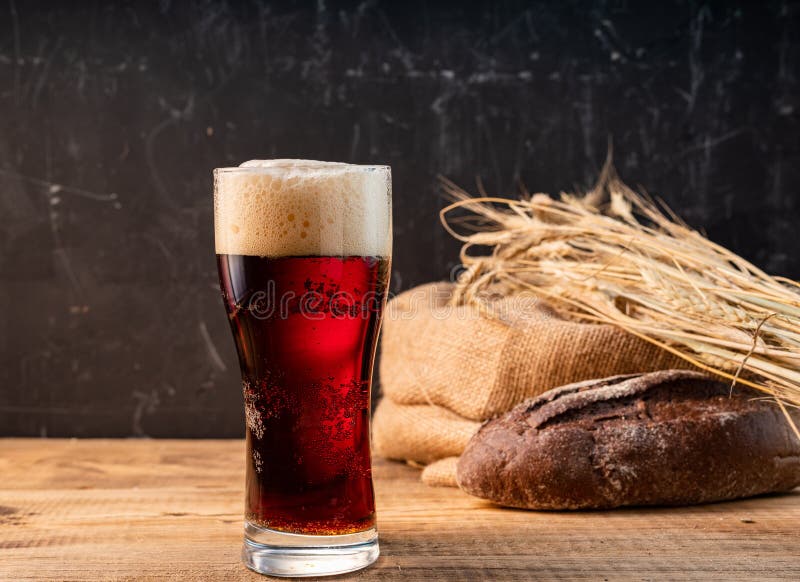 A Glass of Dark Beer. Beer, Wheat and Dark Bread. Dark Beer and Bread ...