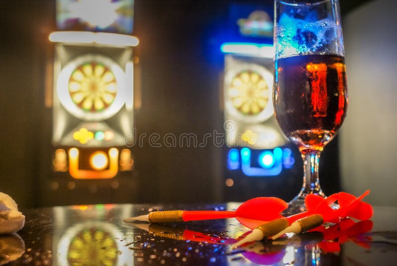 Glass and darts stock photo. Image of darts, orange - 301358512