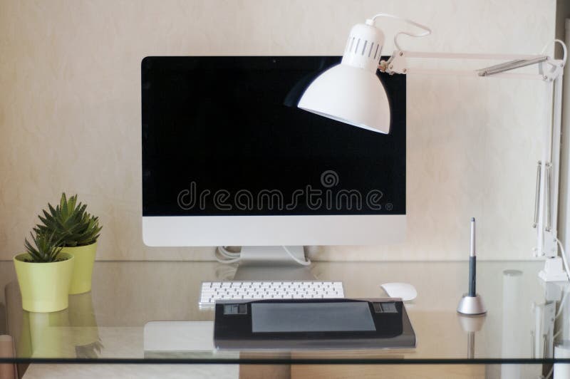 Glass Desk with Computer and Graphic Tablet. Modern Desk Workspace. Designer`s Workspace. Stock ...