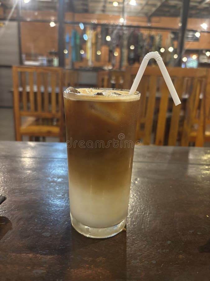 A Glass of Drink with a Base of Coffee and Milk Stock Image - Image of ...