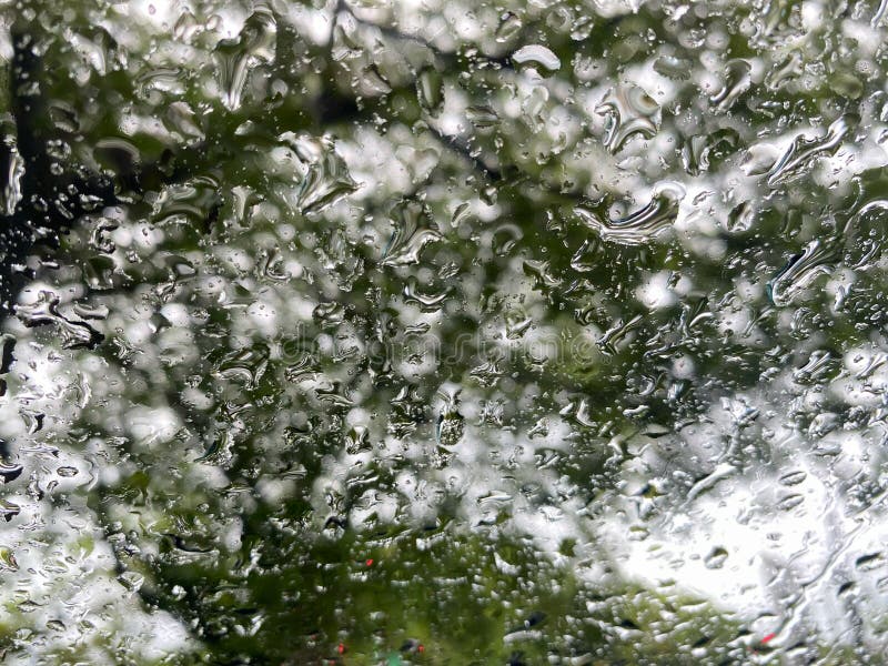 Glass Dripping with Rainwater, Seen from the Inside of the Glass. Water ...