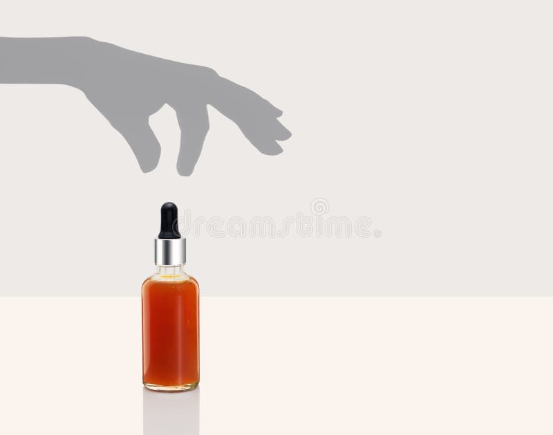 Glass Dropper Bottle with Female Hand Shadow on Light Background Stock ...