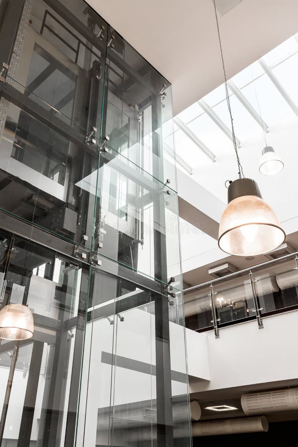 Glass Elevator in Modern Building Stock Image - Image of glass ...