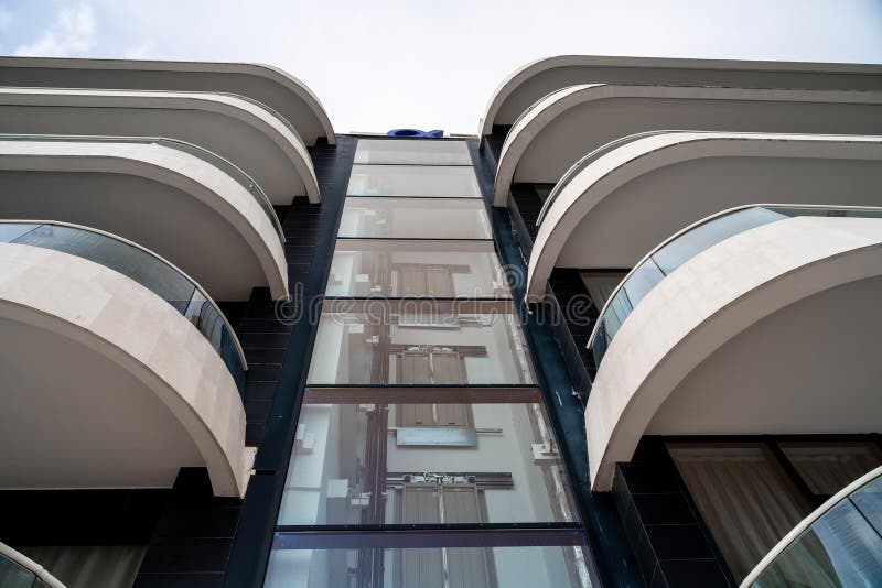 Glass Elevator in a Modern House, Hotel. the Elevator Rises between Two ...