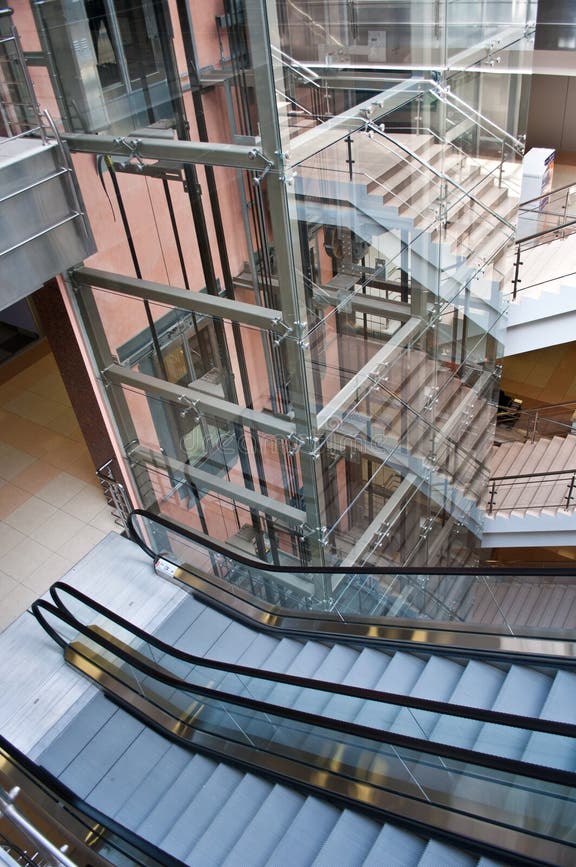 Glass elevator shaft stock image. Image of escalator - 19009369