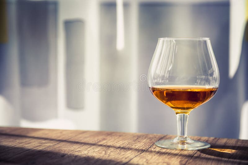 A Glass of Elite Cognac on the Bar Stock Photo - Image of table, elite ...