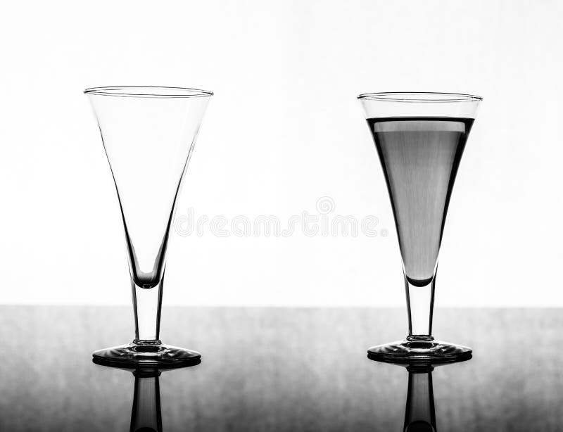 Glass empty and full stock photo. Image of simplicity - 74167614