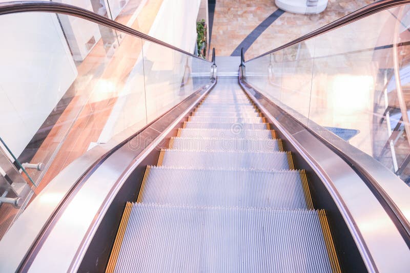 A Glass Escalator with a Yellow Stripe Down the Middle Stock Image ...