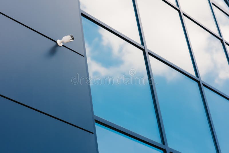 Glass Facade of Modern Office Building with Security Camera Stock Photo ...