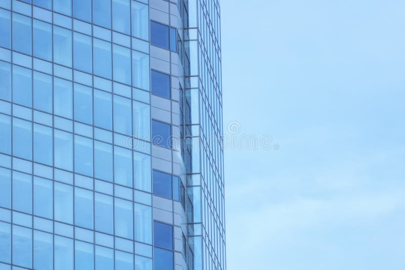 The Glass Facade of a Skyscraper with a Mirror Reflection of Sky ...