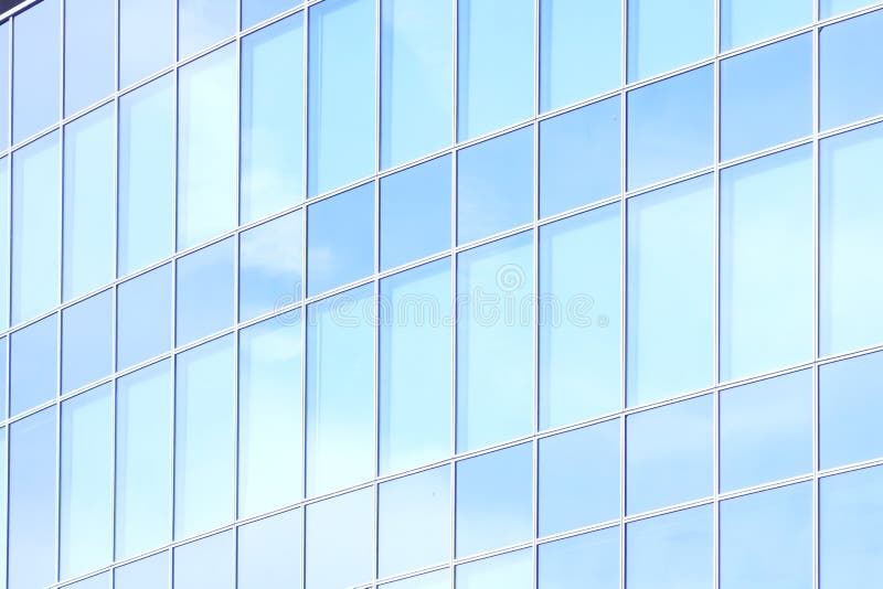 The Glass Facade of a Skyscraper with a Mirror Reflection of Sky ...