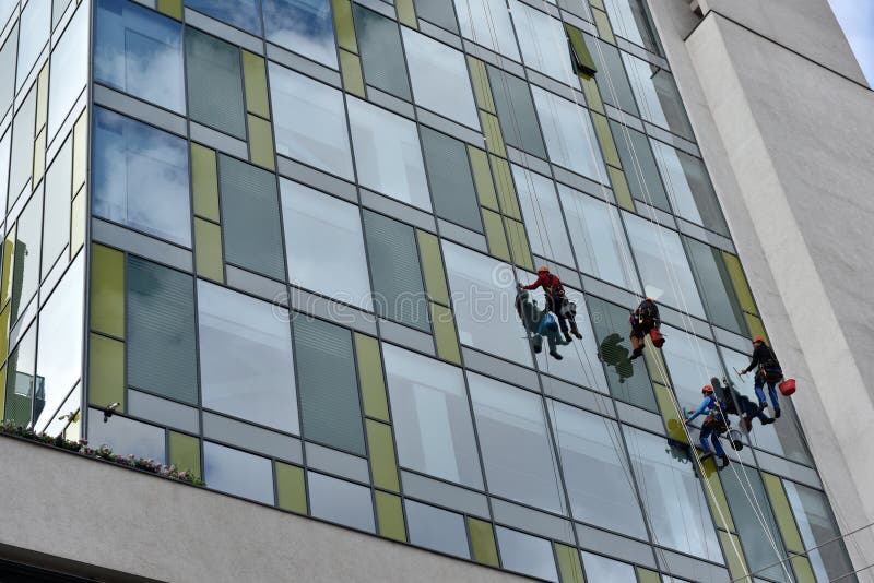 Glass Facade Skyscrapper Window Cleaners Hanging on Rope Stock Image ...