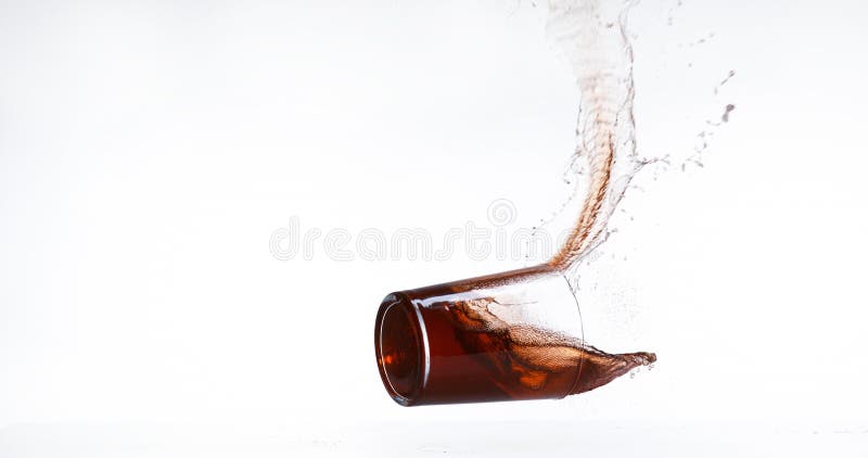 Glass Falling and Red Wine Splashing Against White Background Stock ...