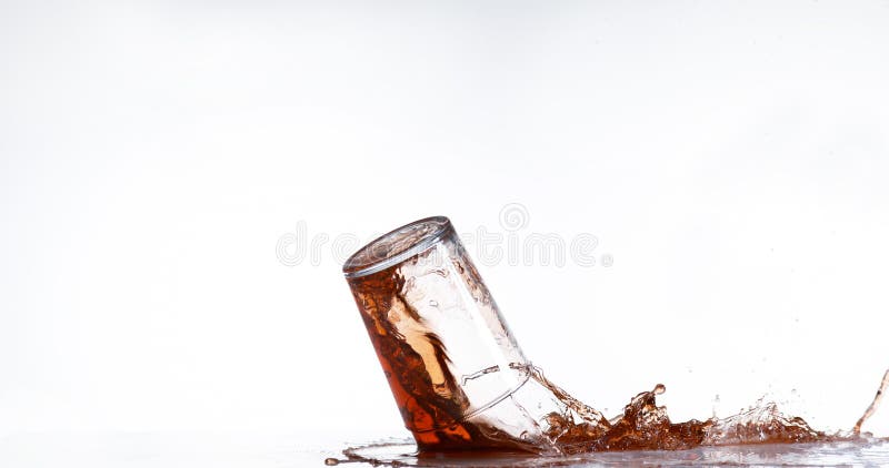 Glass Falling and Red Wine Splashing Against White Background Stock ...