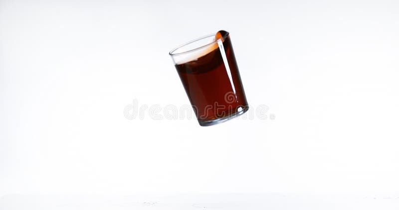 Glass Falling and Red Wine Splashing Against White Background Stock ...