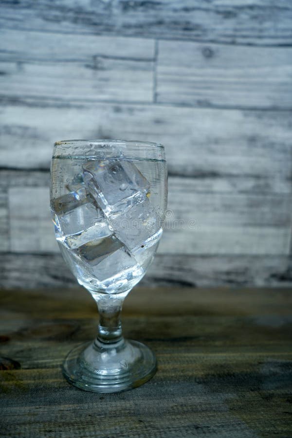 Glass Filled with Water on a Wooden Table Stock Photo - Image of cold ...