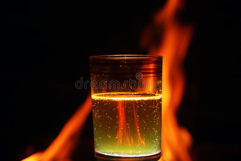 Glass of Fizzy Water Infront of the Fire Stock Image - Image of fire ...