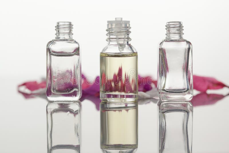 Glass Flasks and Pink Petals Focus on the Flasks Stock Image - Image of ...