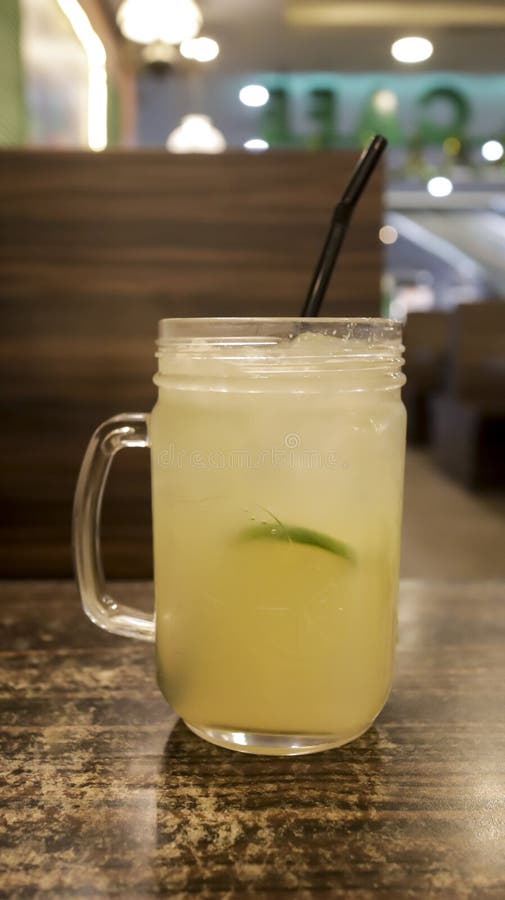 A Glass of Fresh Lime Ice with a Lime Slices Served at the Table Stock ...