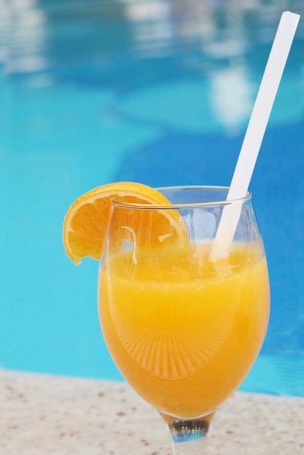 Glass of Fresh Orange Juice Near the Pool Stock Photo - Image of water ...