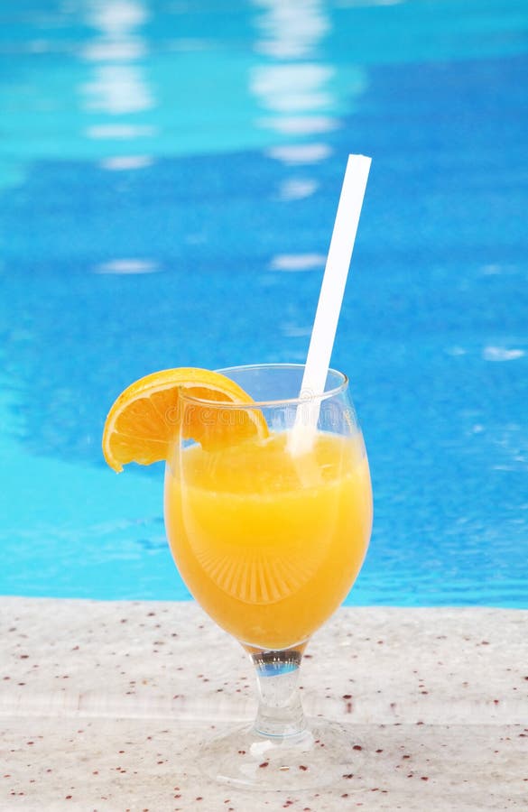 Glass of Fresh Orange Juice Near the Pool Stock Image - Image of juice ...
